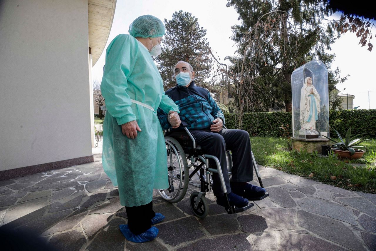 Hands touch: Italy's nursing homes emerge from COVID tunnel