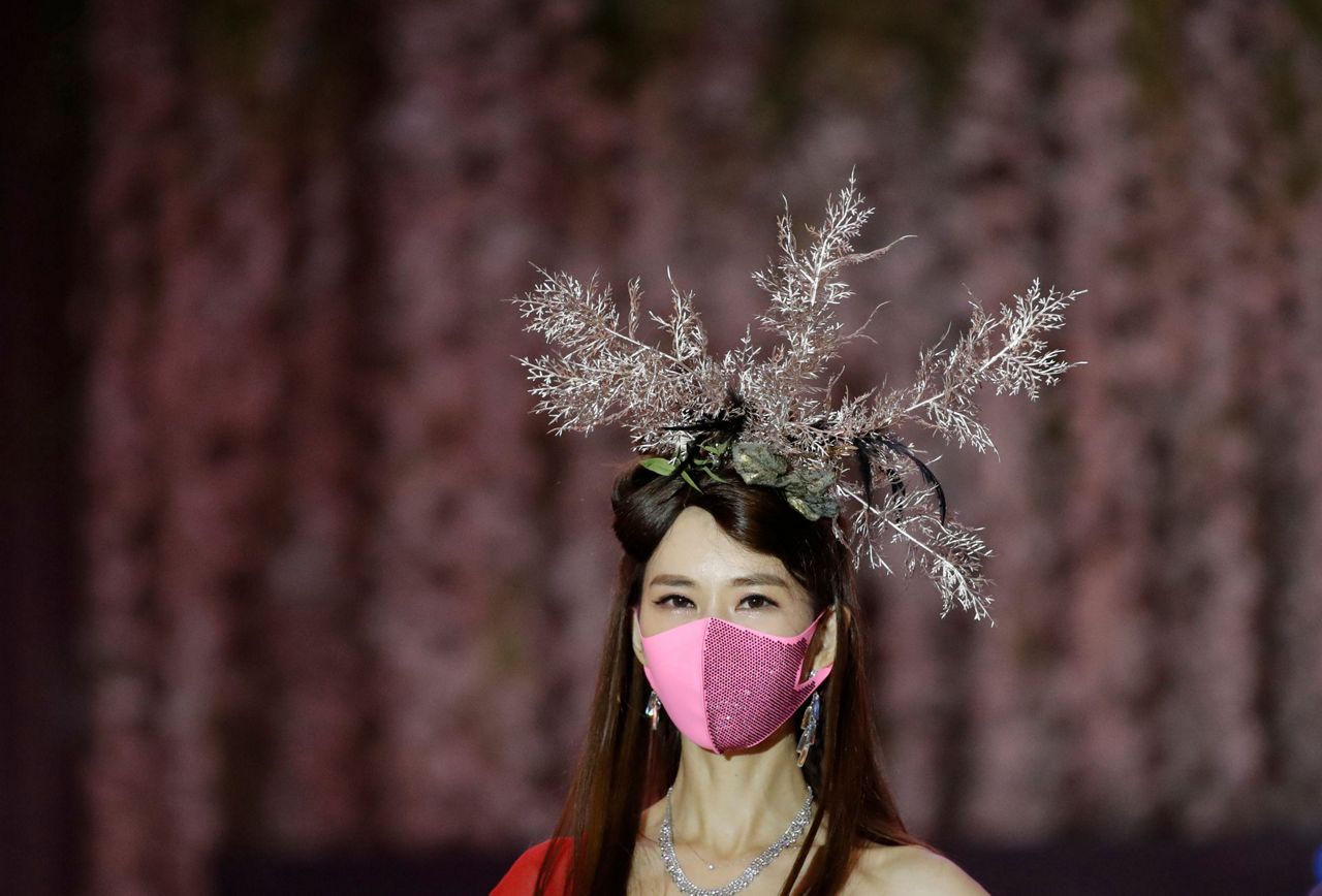 AP PHOTOS: Masked fashion models walk Seoul runway