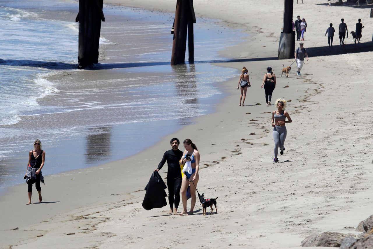 Surf’s up and so are new beach rules to prevent virus spread