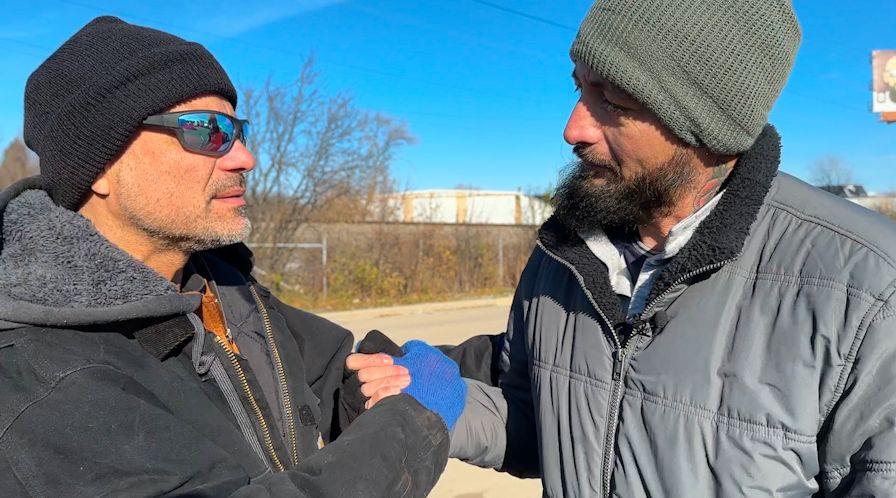 Walter Garron hands out winter coats to those in need