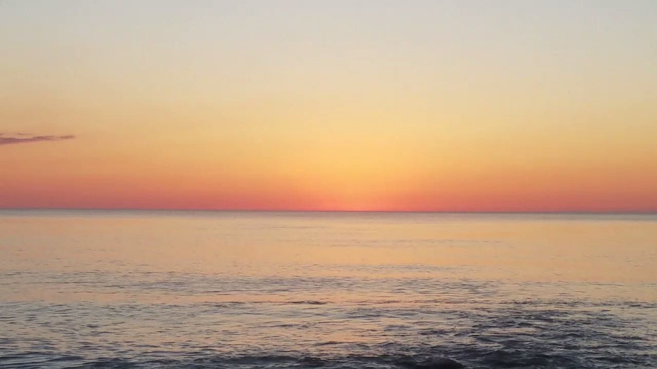 Why do we see vibrant colors at sunrise and sunset?