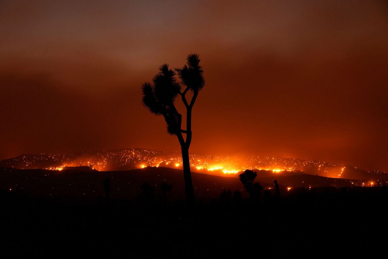 Desert communities told to evacuate as winds stoke flames
