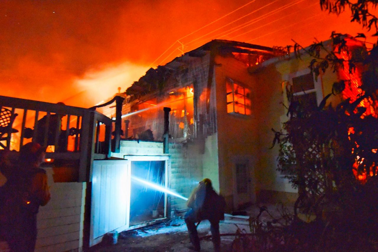 New wildfires sweep through California, burning homes