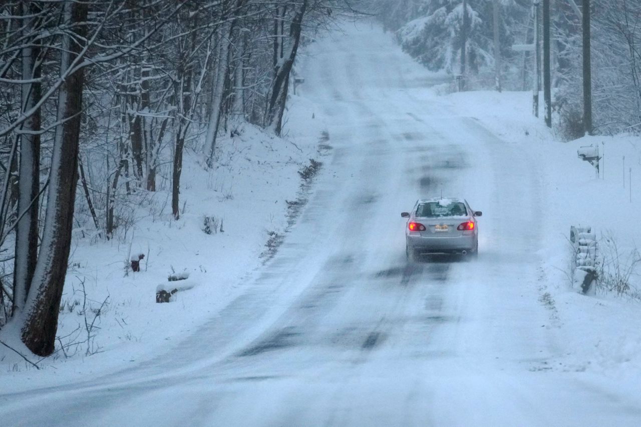 Winter storms dump snow on both US coasts as icy roads make for hazardous travel