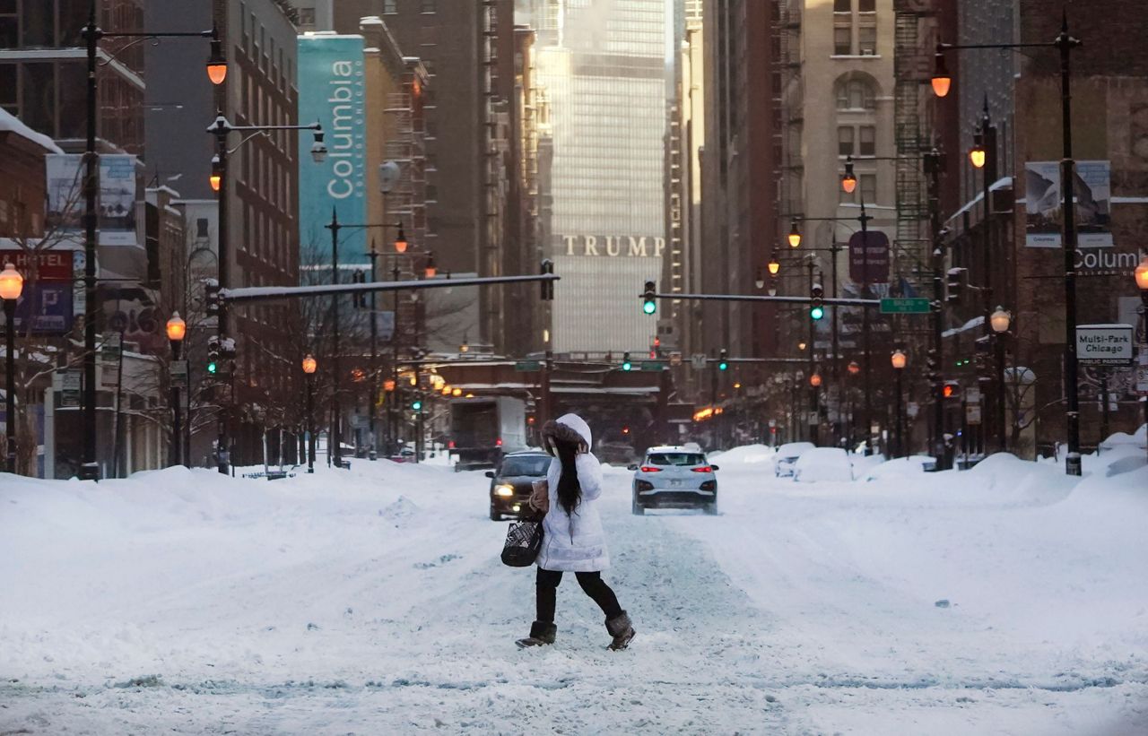 The Latest: Some US cities record coldest weather in decades