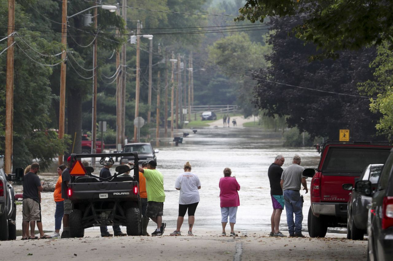 Crews search for man swept away in Wisconsin flooding