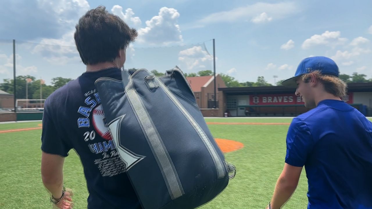 Xavier baseball player teaching kids to love the game