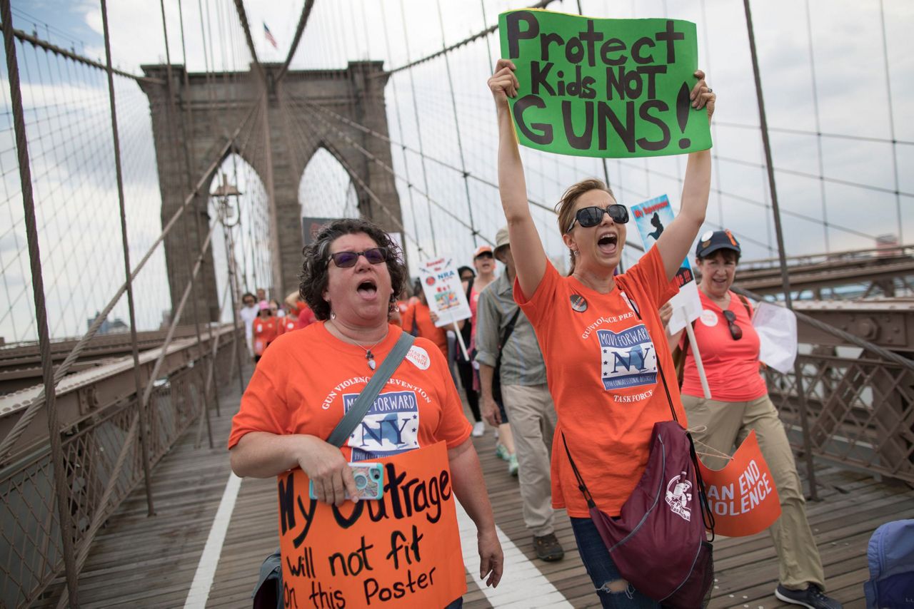 Thousands march across NYC's Brooklyn Bridge in gun protest