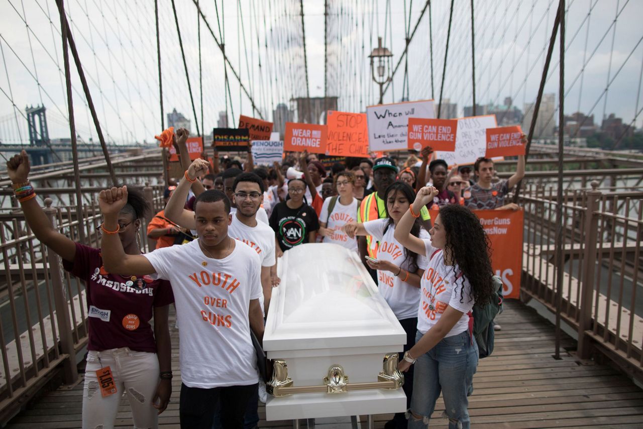 Thousands march across NYC's Brooklyn Bridge in gun protest