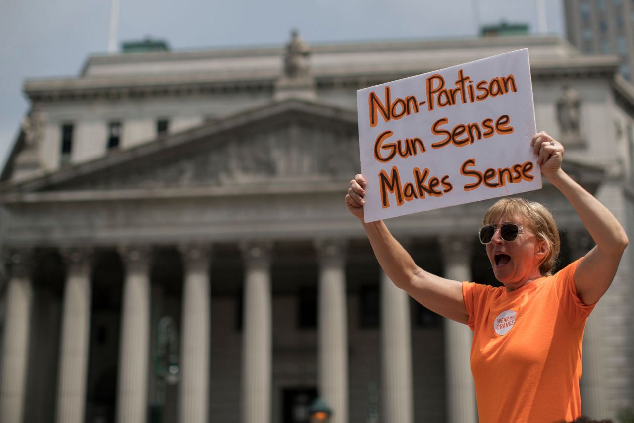 Thousands march across NYC's Brooklyn Bridge in gun protest