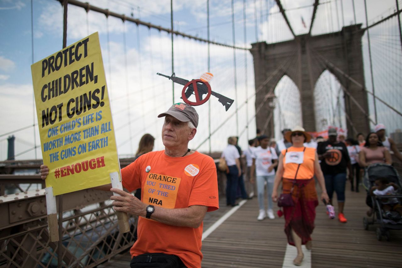 Thousands march across NYC's Brooklyn Bridge in gun protest