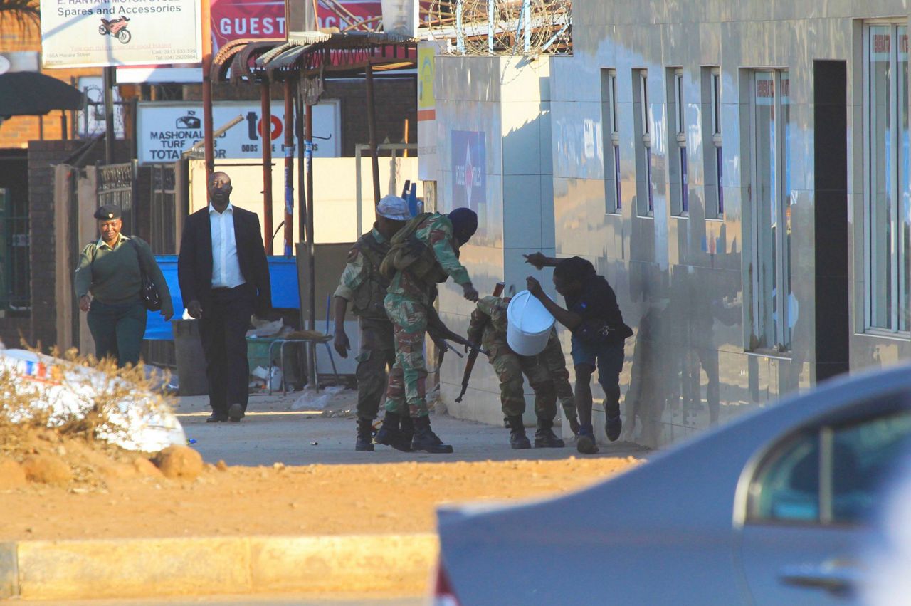 Zimbabwe inquiry says army, police responsible for killing 6
