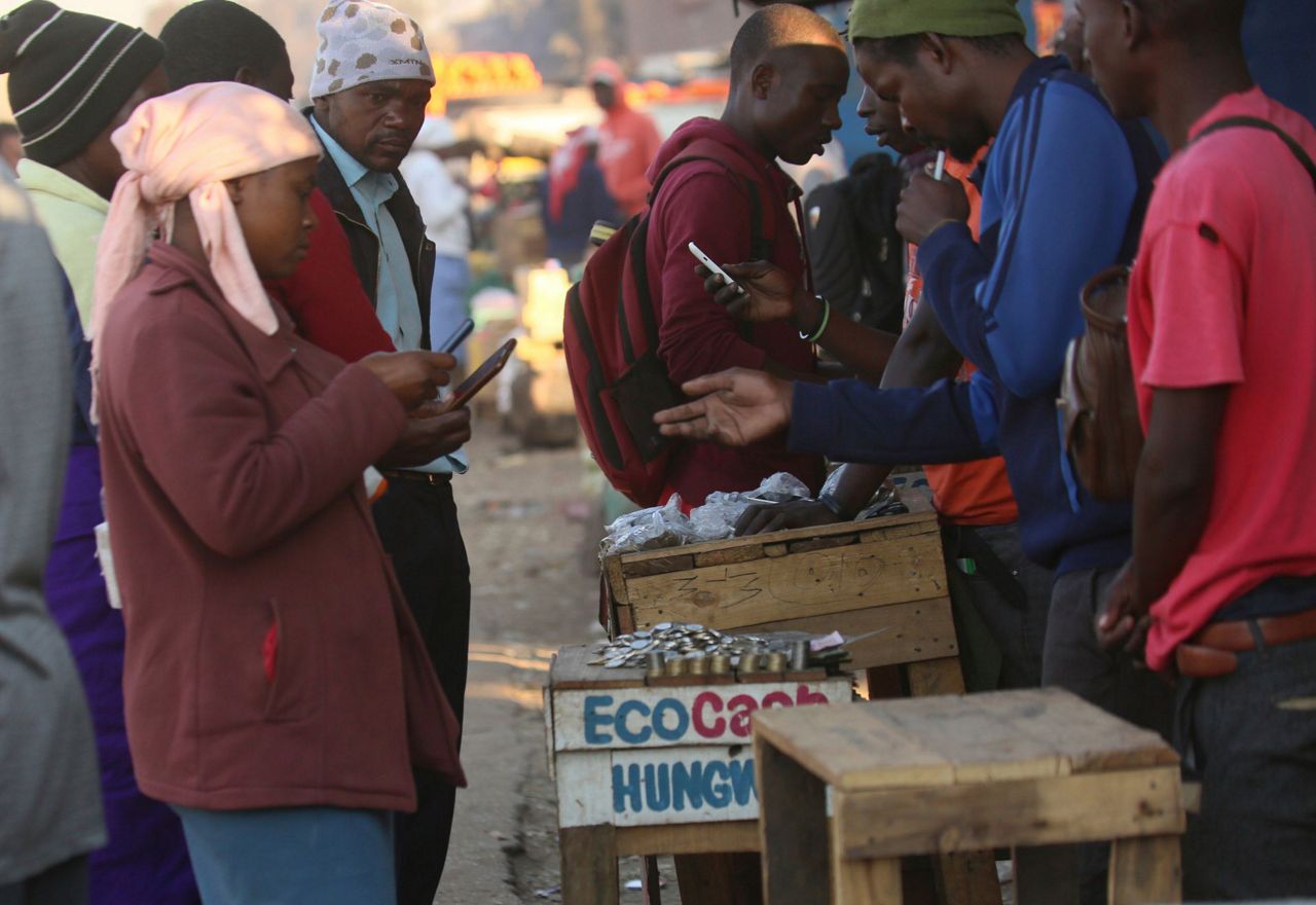 Desperate Zimbabweans use cell phone transfers to get cash