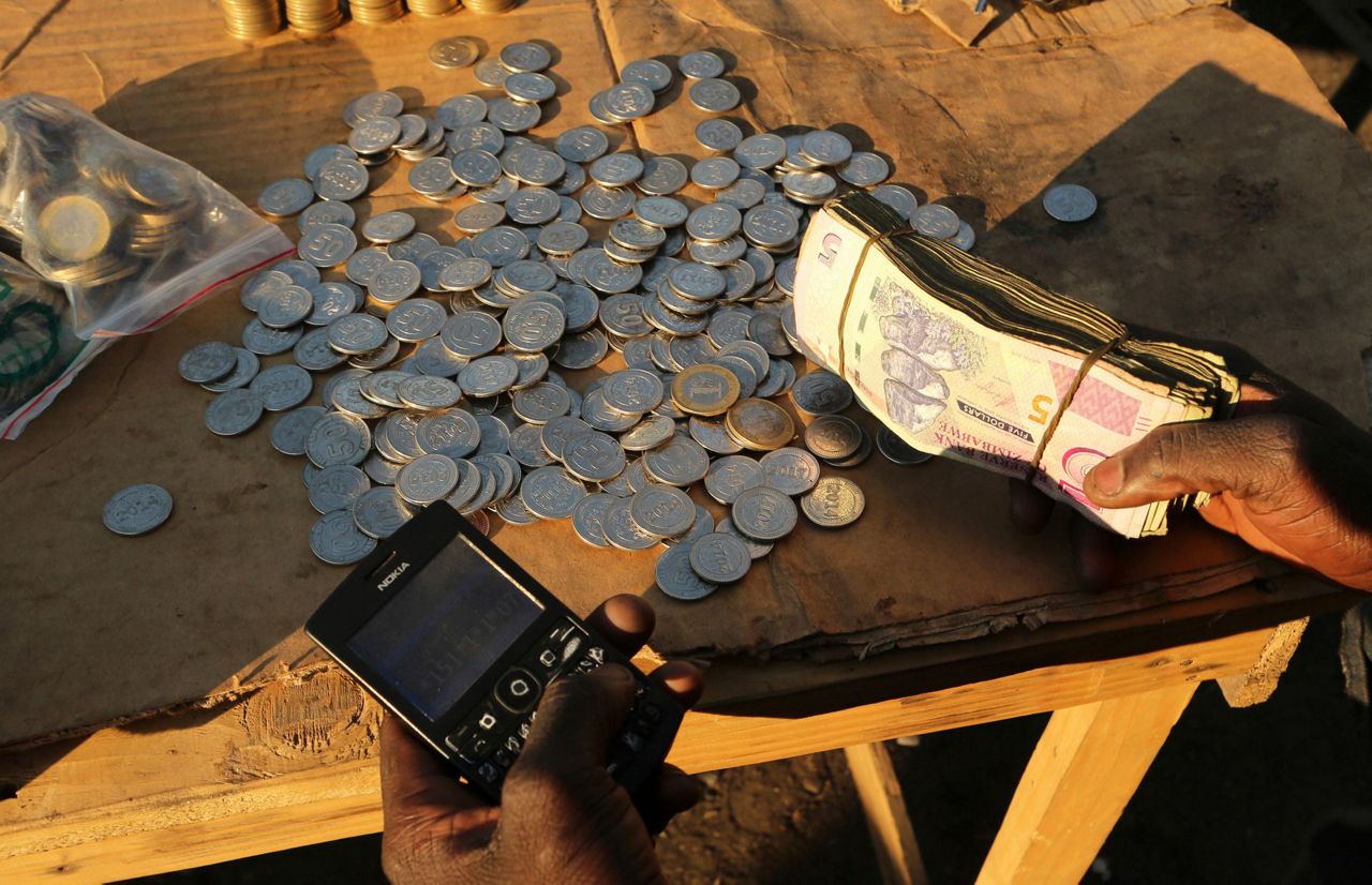 Desperate Zimbabweans use cell phone transfers to get cash
