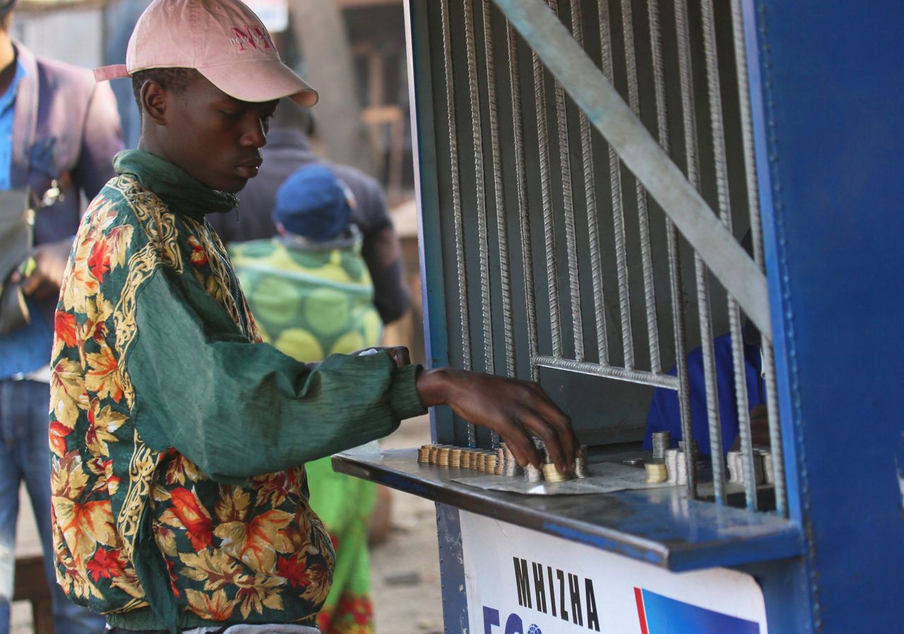 Desperate Zimbabweans use cell phone transfers to get cash