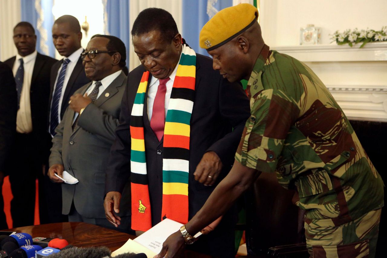 As Zimbabwe's leader preaches a new era, military a concern
