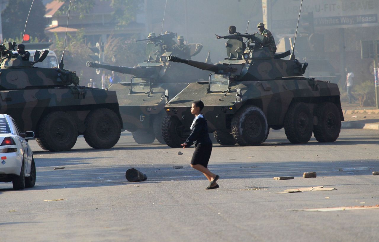 As Zimbabwe's leader preaches a new era, military a concern
