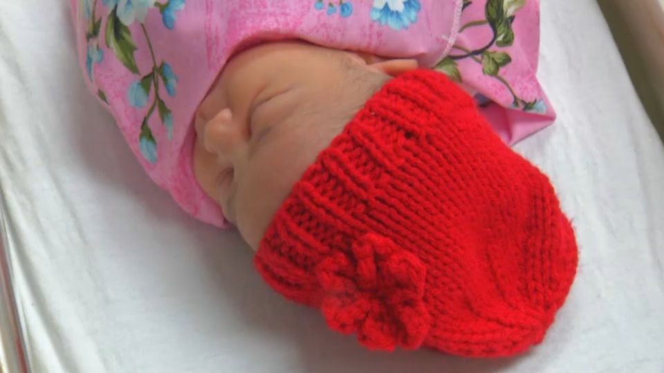 Albany Boy Hands Out Red Hats to Raise Awareness