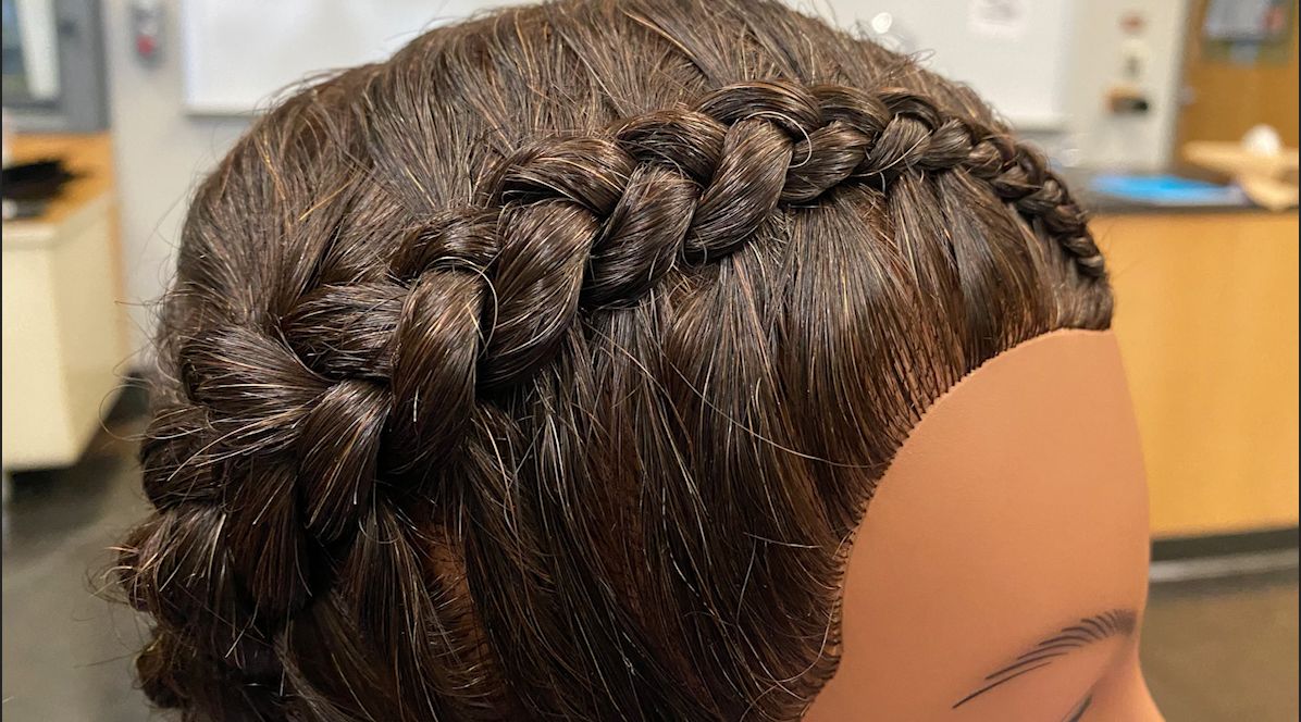 Students learn braiding and barbering skills at Bradley Tech