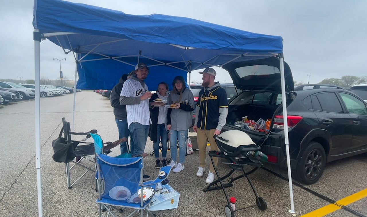 Tailgaters brave cold, rainy weather before Brewers game