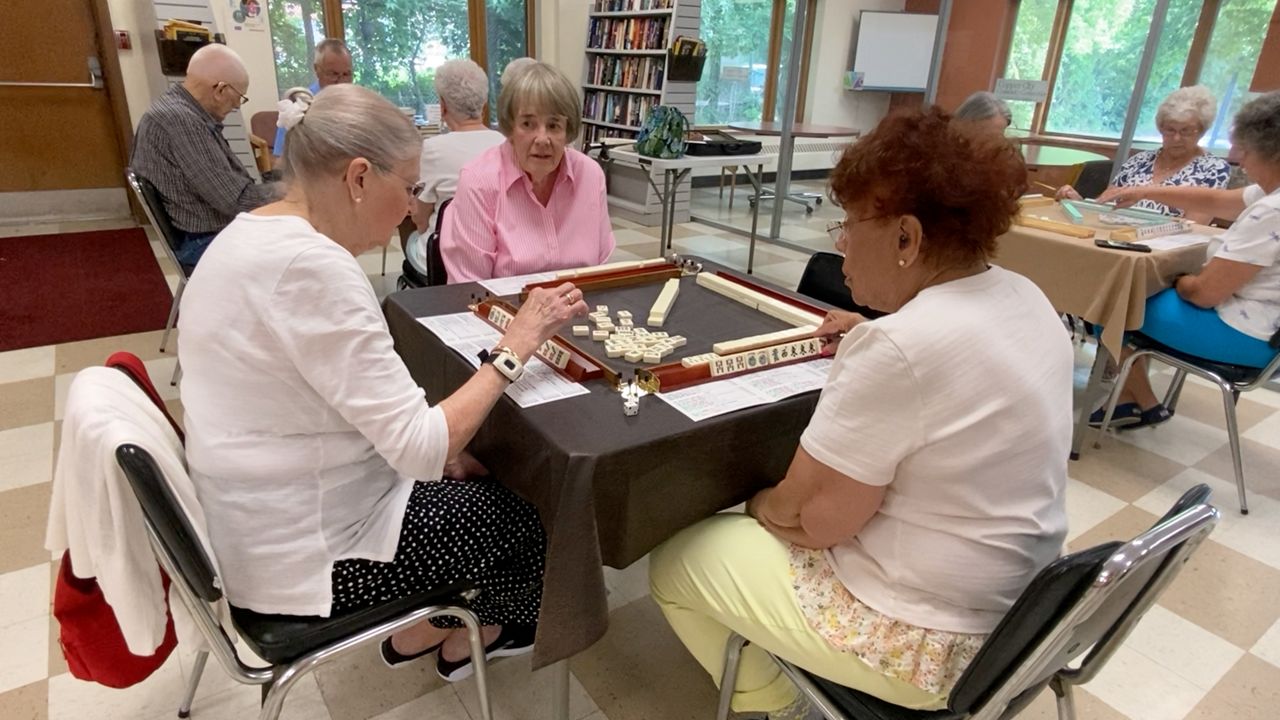 Seniors socializing at senior centers again