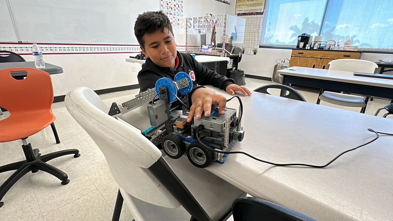 Immigrant parents learn robotics, coding