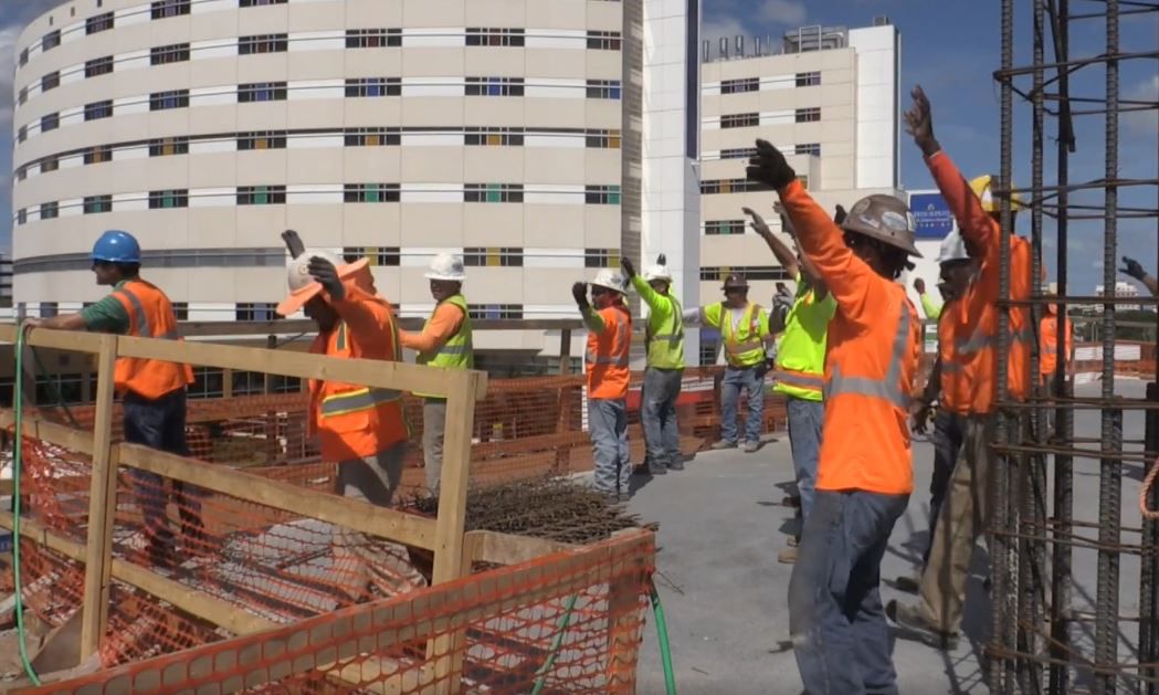 Construction Workers Dance To Delight Of Young Patients