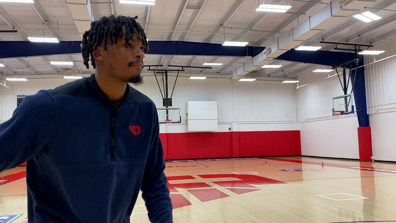 DaRon Holmes helps lift the Dayton Flyers