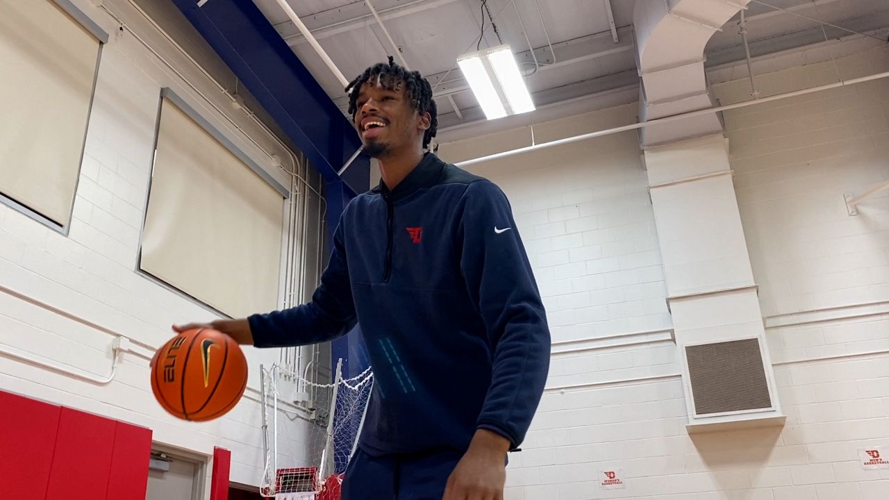 DaRon Holmes helps lift the Dayton Flyers