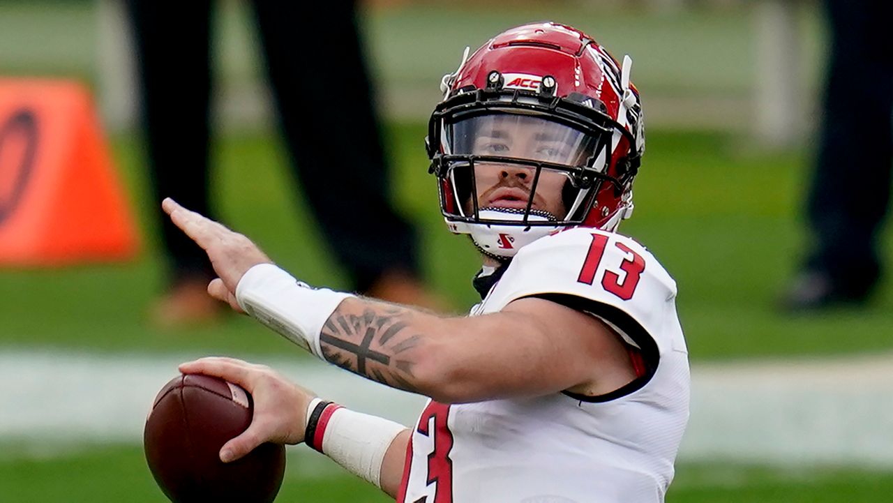 Wolfpack Riding the Arm of Devin Leary