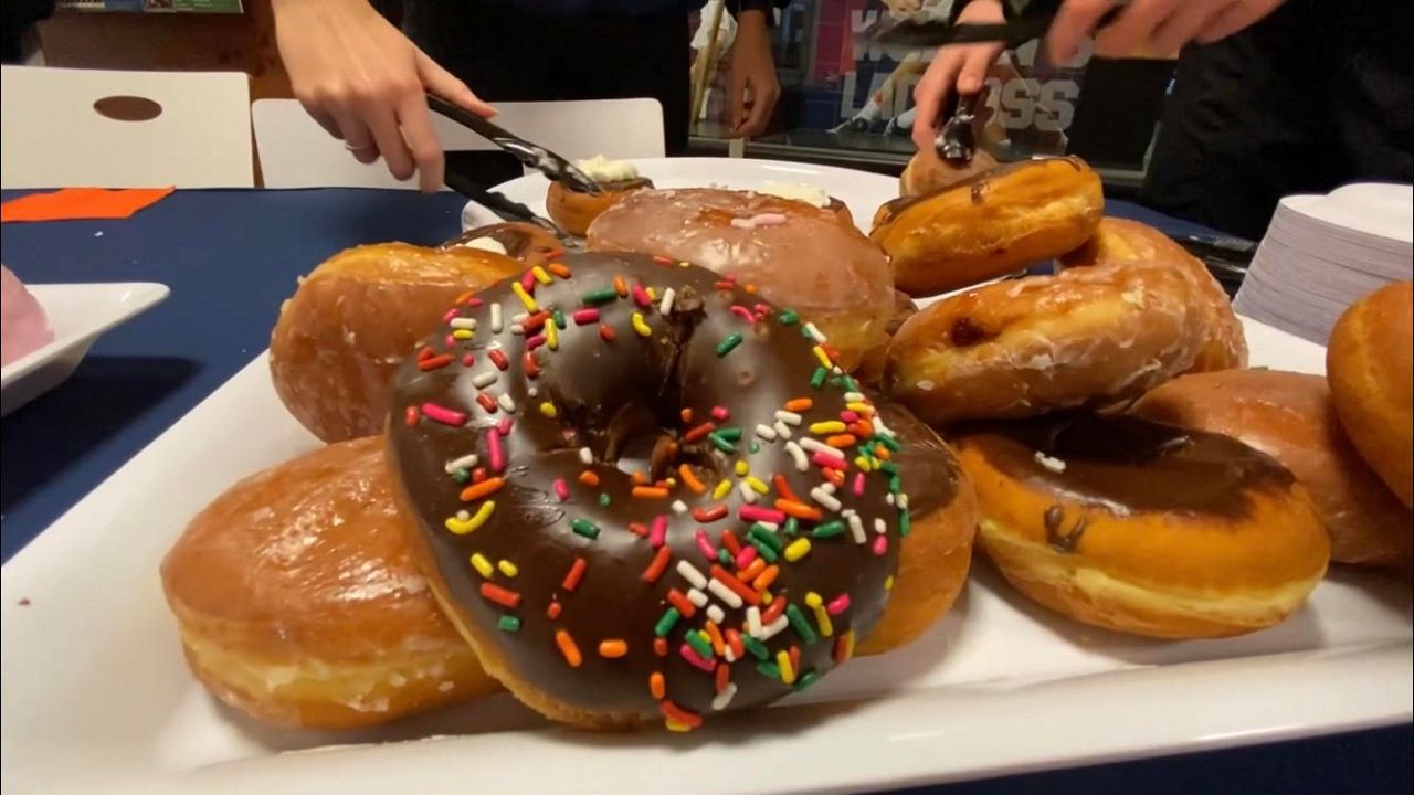 SU athletes mix donuts with democracy on Election Day