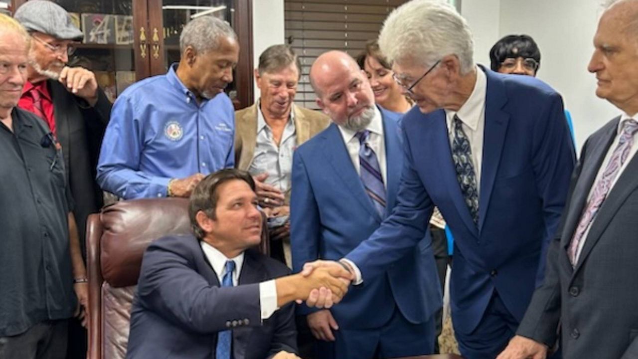 Governor signs bill creating fund for Dozier victims