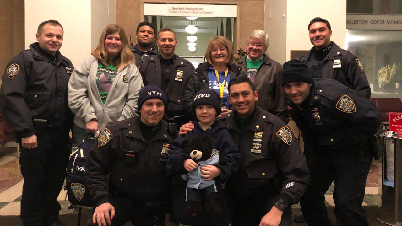 NYPD forms year-long friendship with boy undergoing brain surgery