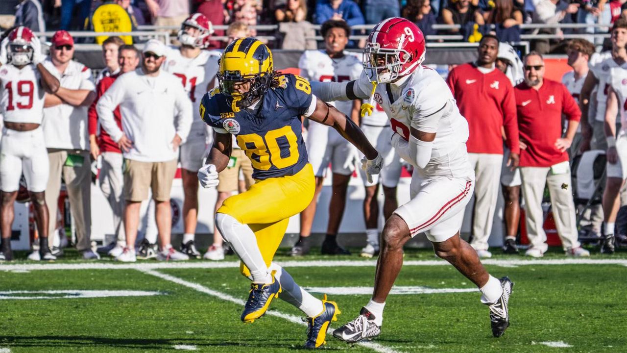 Former St. John's star helps lead Michigan to CFP title game