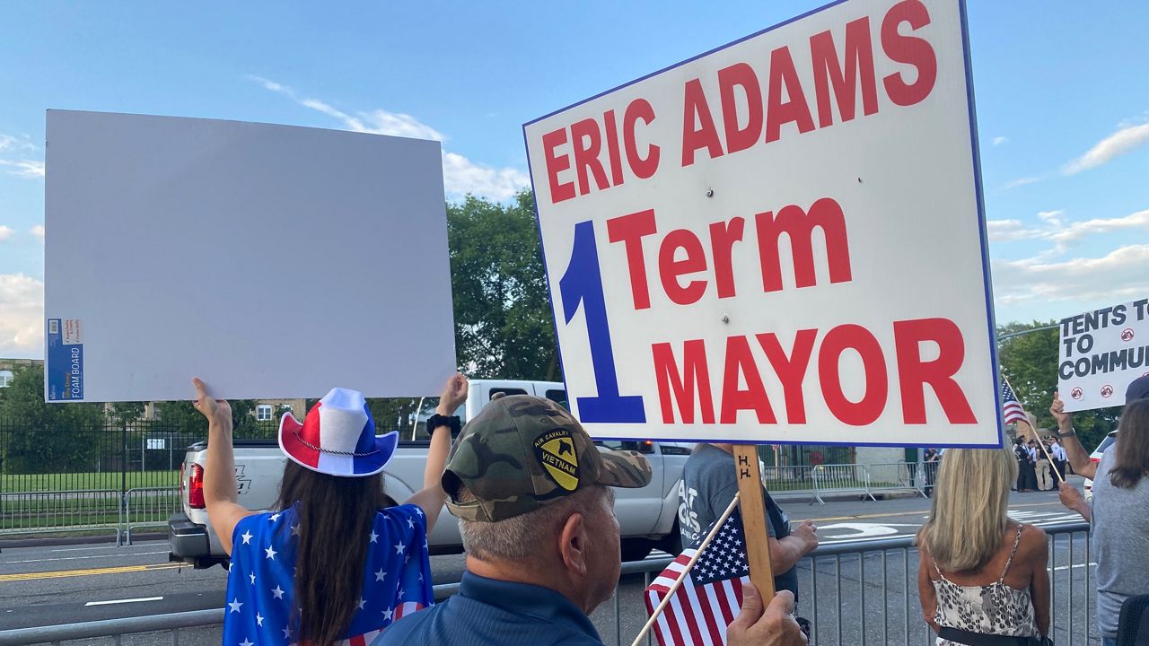 Protests erupt outside new migrant facility in Queens