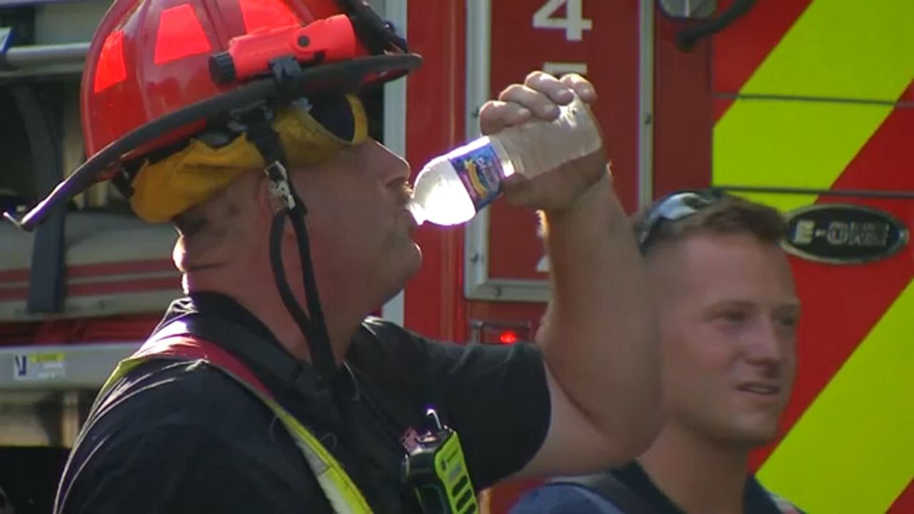 Firefighters work to beat the heat