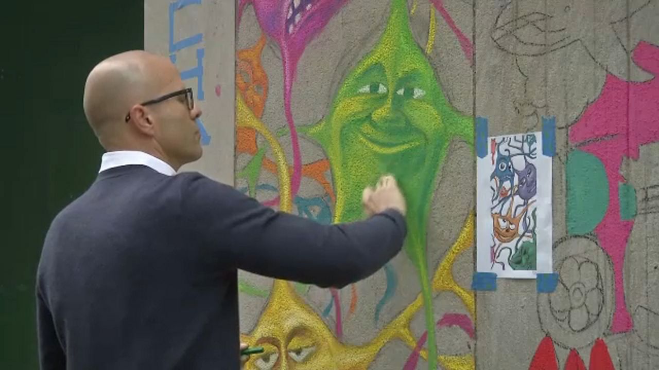 Fashion students use "Dreamers" as inspiration for chalk mural