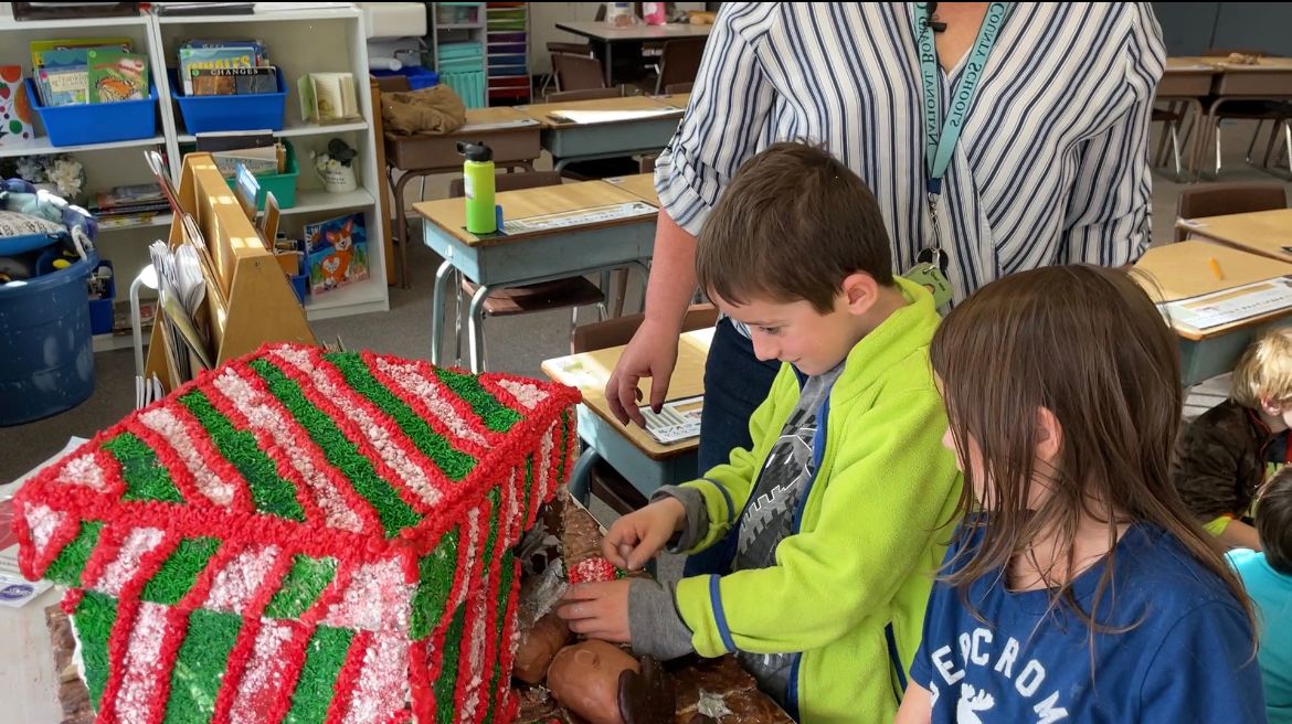 First-grade teacher, class enter gingerbread house contest