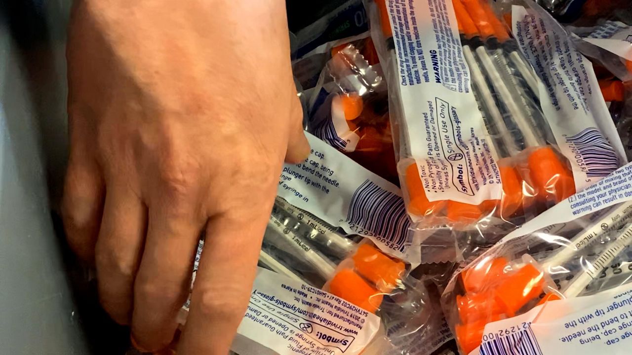 Priest volunteers at needle exchange to reduce stigma
