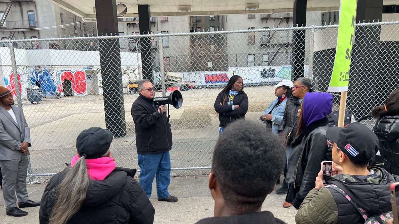 Community members protest vacant gas station plan