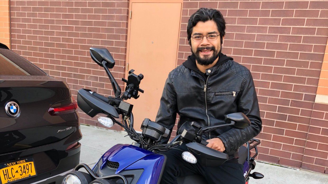 Delivery worker run over by truck after motorcycle accident