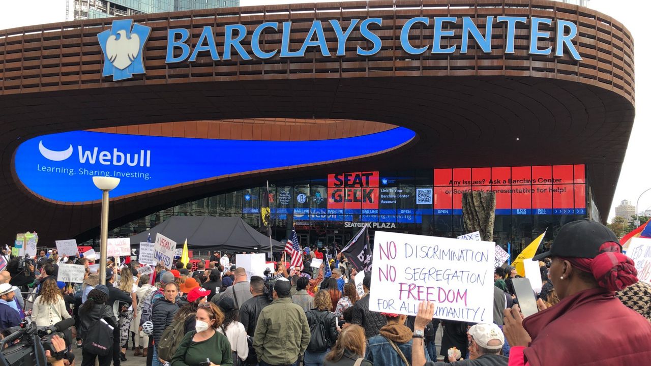 Kyrie Irving fans protest city's vaccine mandate