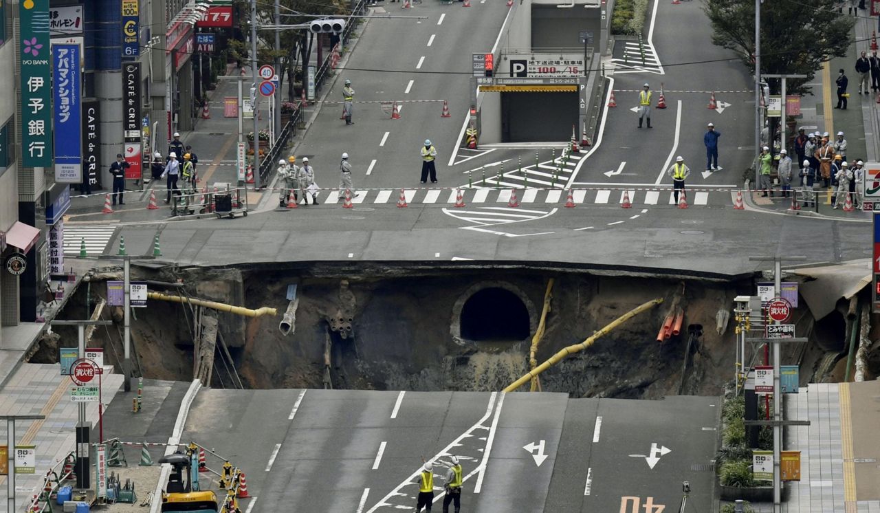 Southern Japan City Street Collapse Creates Massive Sinkhole