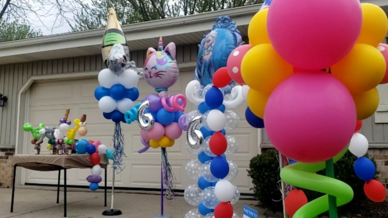 Jesters create balloon art to lift spirits during pandemic