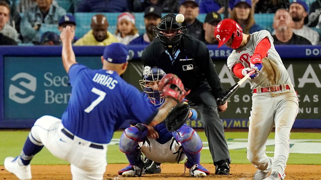 Harper 0 for 4 in return, Urías helps Dodgers top Phils 13-1