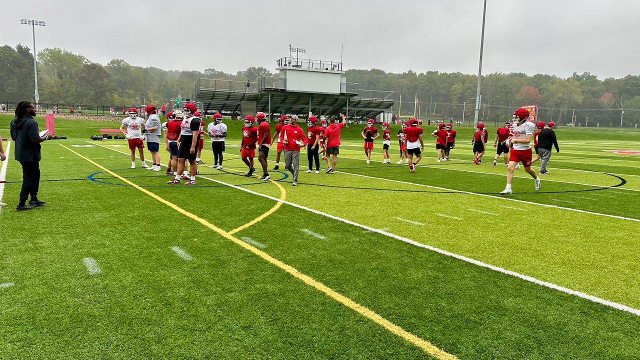 St. John's football team stacking great practices