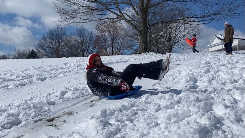 Families in Lexington went sledding during late season snow