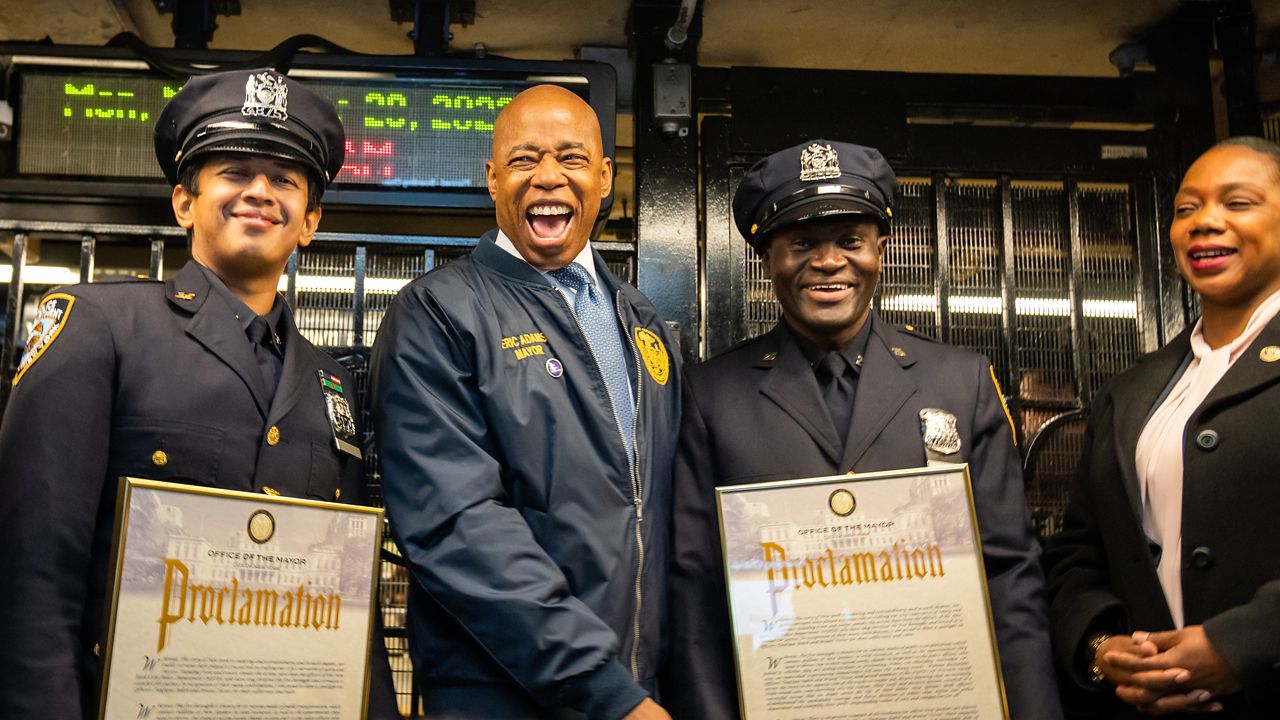 Mayor honors cops who saved man from train on Thanksgiving
