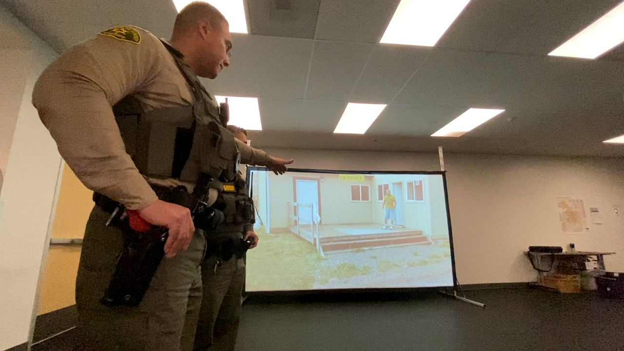 Deputies refresh on de-escalation training using simulator