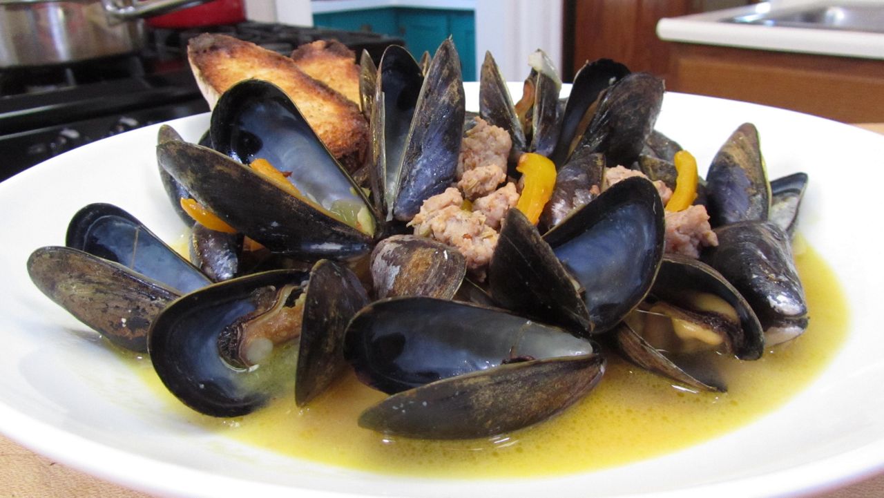 Steamed Mussels with Italian Sausage, Peppers, Onions and White Wine